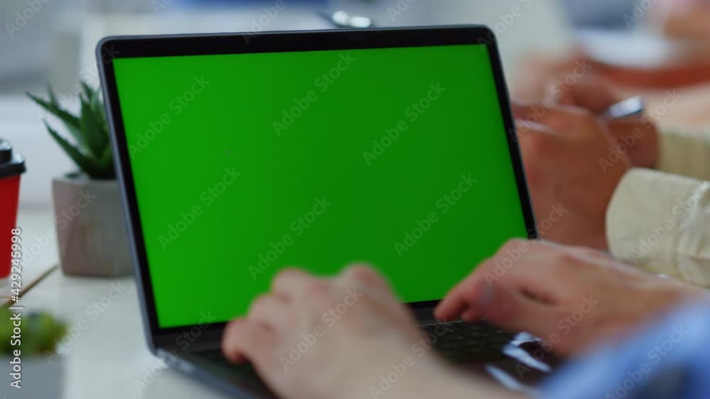 Man hands typing green screen laptop. Unknown businessman working ...
