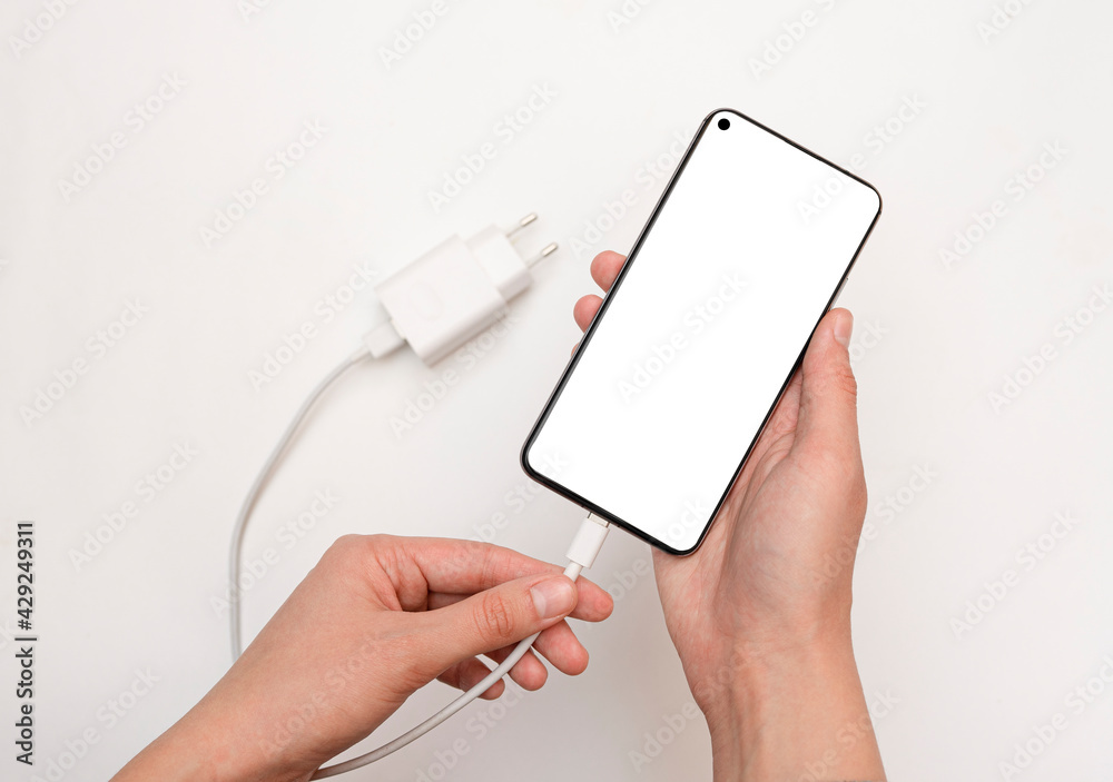 Connecting charging a smartphone via a USB cable and a power supply ...