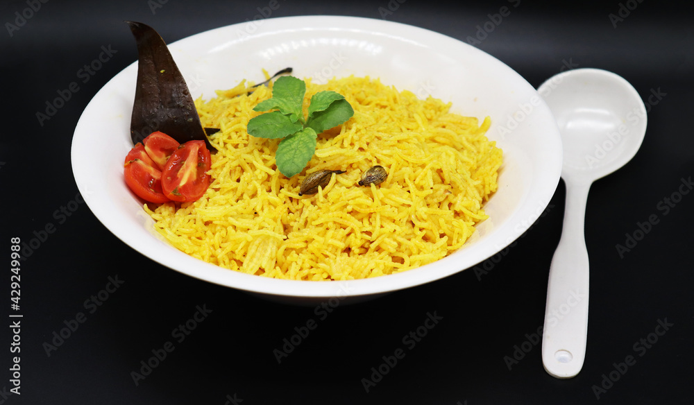 Cooked turmeric jasmine rice with powdered curcumin or Haldi, Indian ...