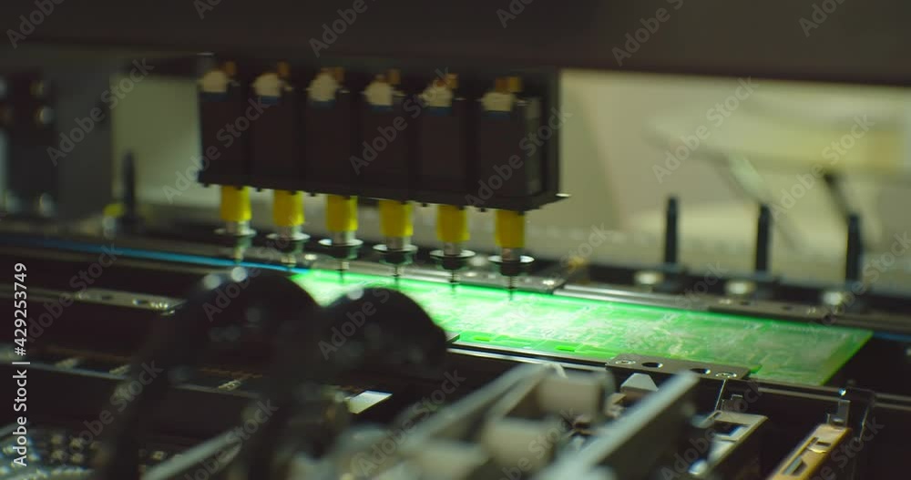 High-tech production.A modern industrial robot for electronics ...