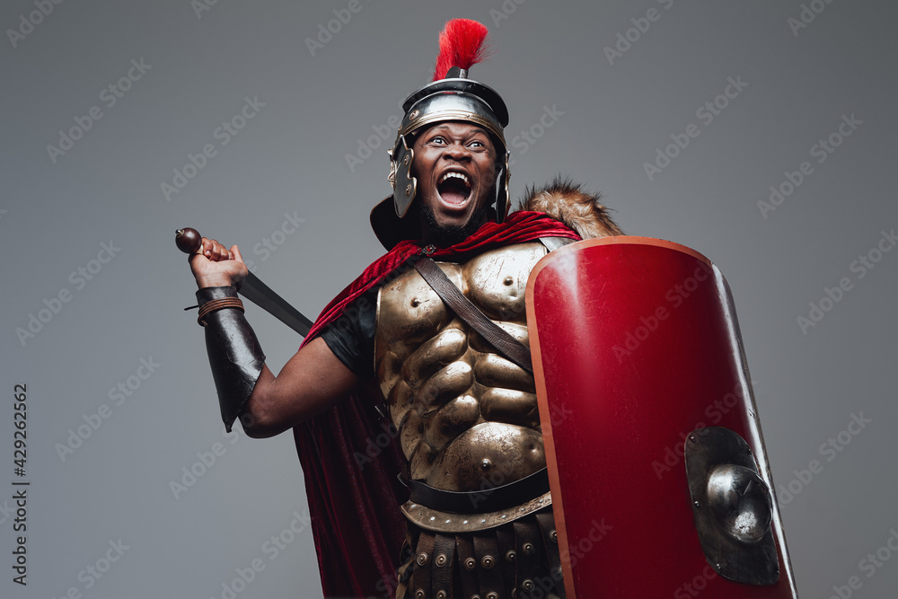 Violent roman warrior in fight pose with sword foto de Stock | Adobe Stock