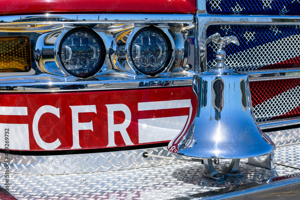 Bright chrome and brass bell, eagle on the front of a fire truck and ...