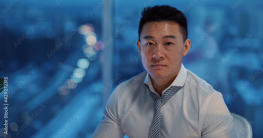 Indoor portrait of corporate leader chinese financial manager reading ...