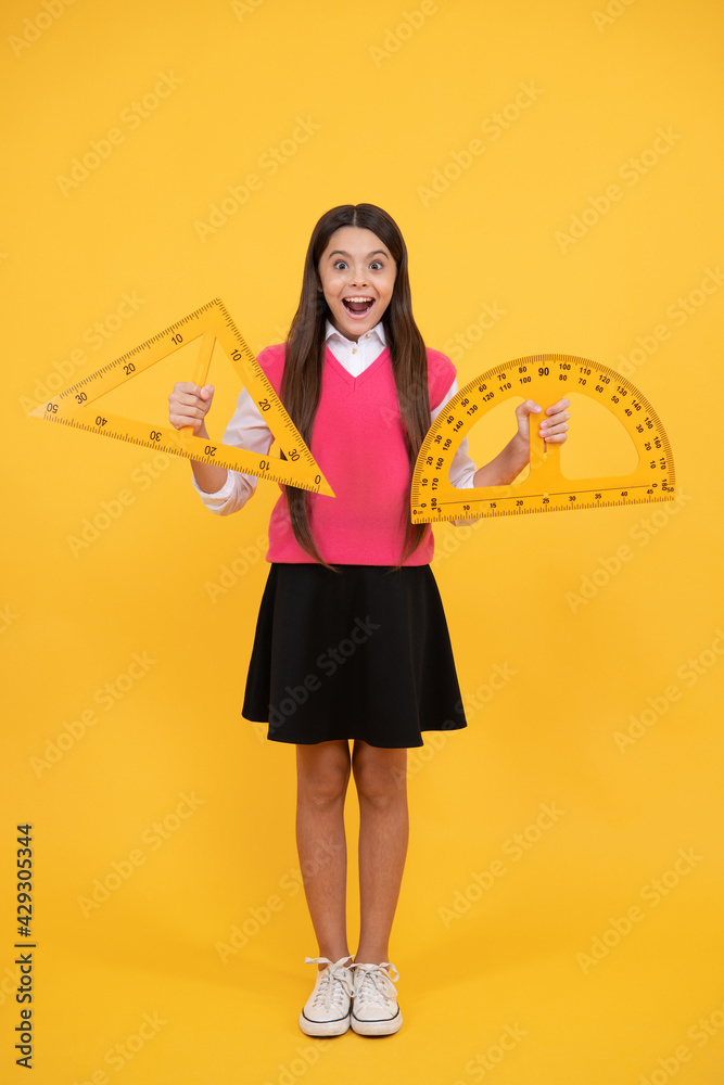 surprised teen girl study math with protractor and triangle measuring ...