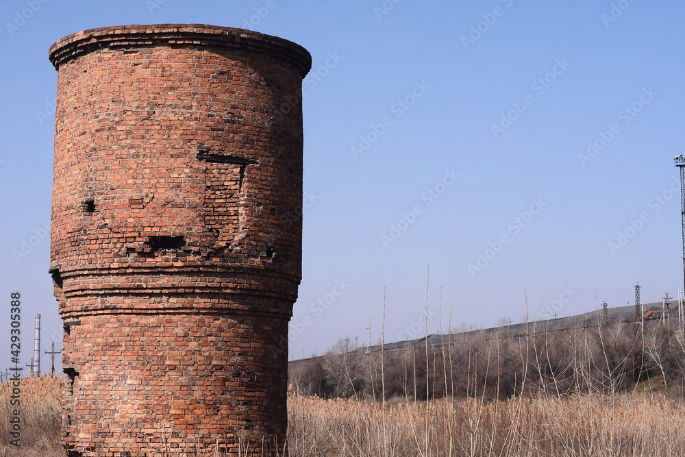 Water tower. An old large ruined building. There were no windows or ...