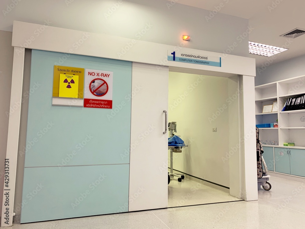 X-ray room in operation with the alert lamp on and radiation sign on ...