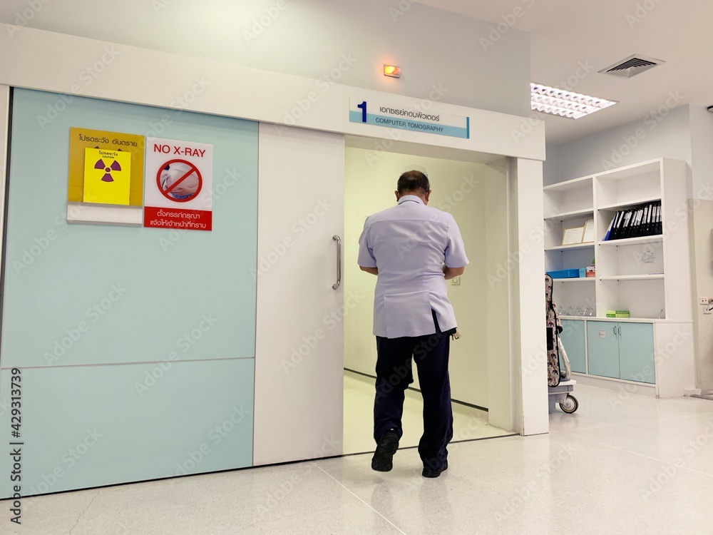 X-ray room in operation with the alert lamp on and radiation sign on ...