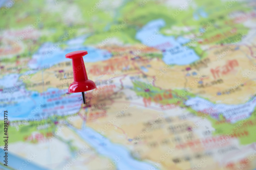 Red pin marked a city on a map Stock Photo | Adobe Stock