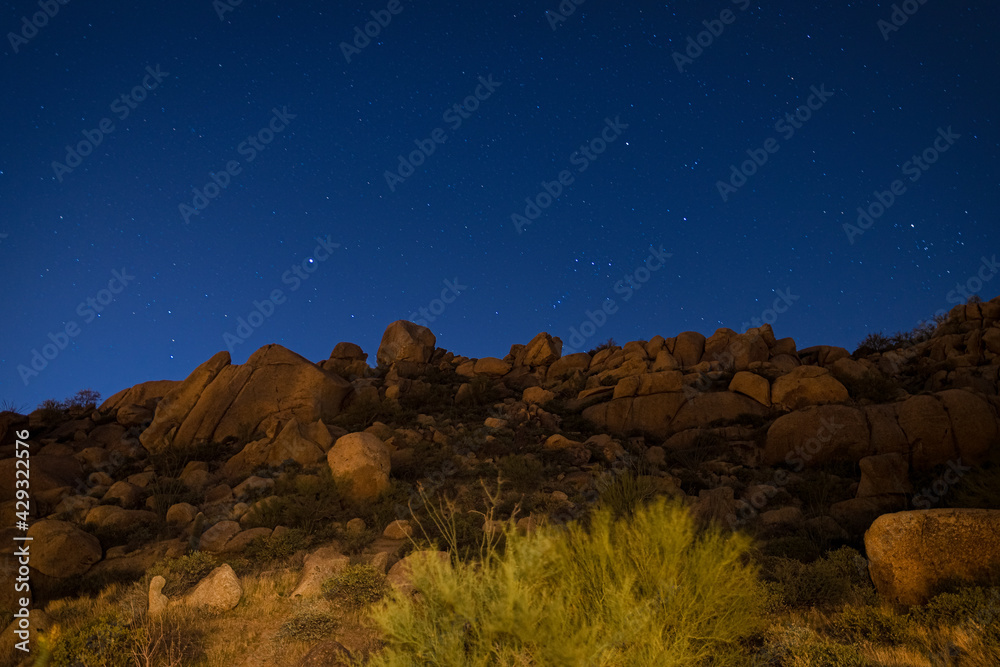 Starry night sky over rocky Arizona desert mountainside Stock Photo ...