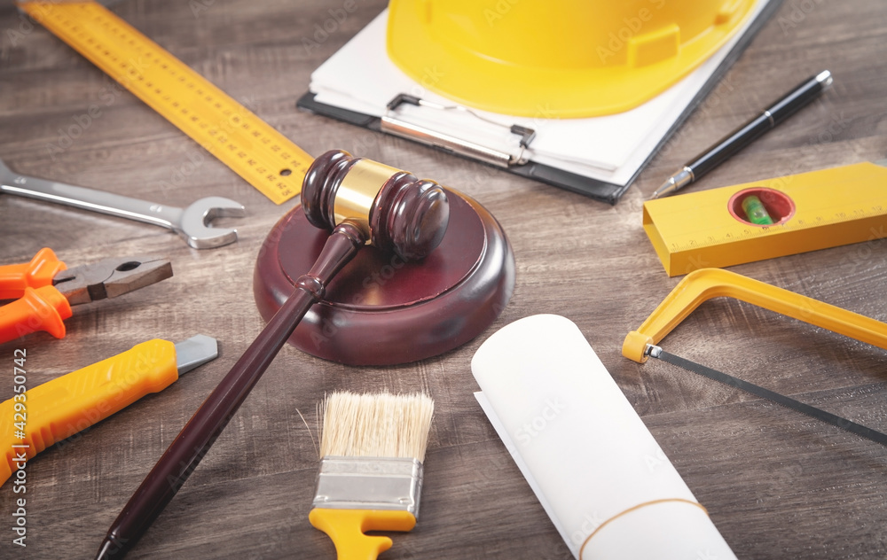 Judge gavel, safety helmet and working tools. Construction Law Stock ...