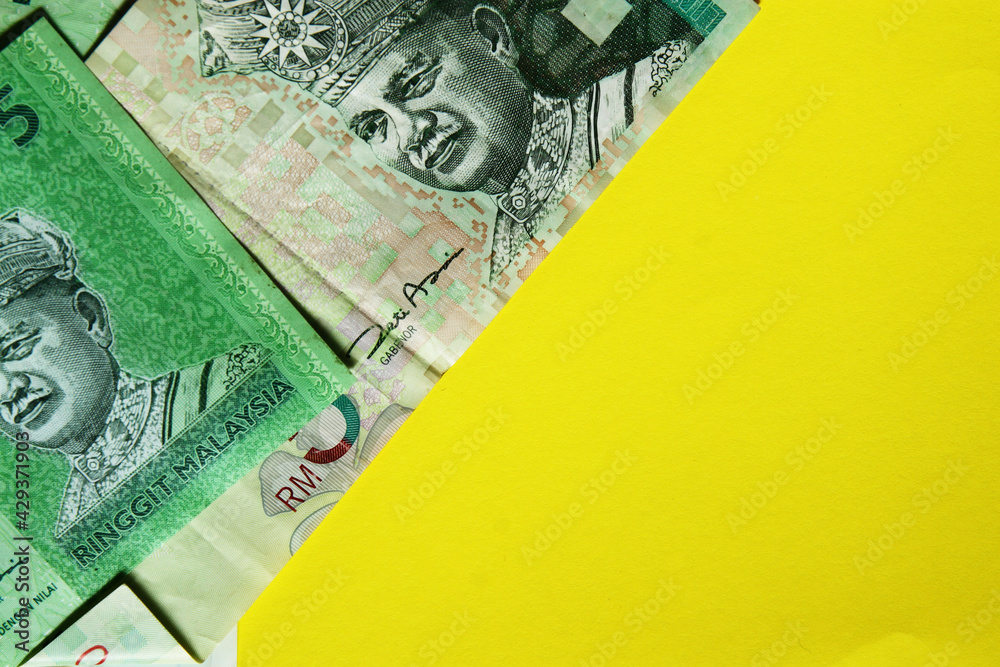 Banknote of Five Malaysian Ringgit is made of polymer plastic and green ...