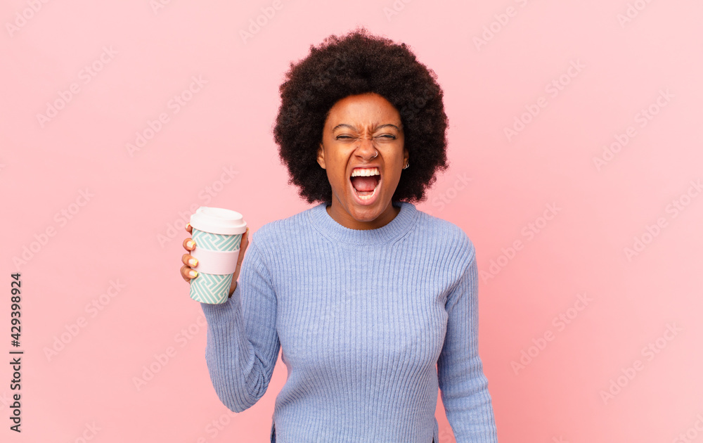 afro woman shouting aggressively, looking very angry, frustrated ...