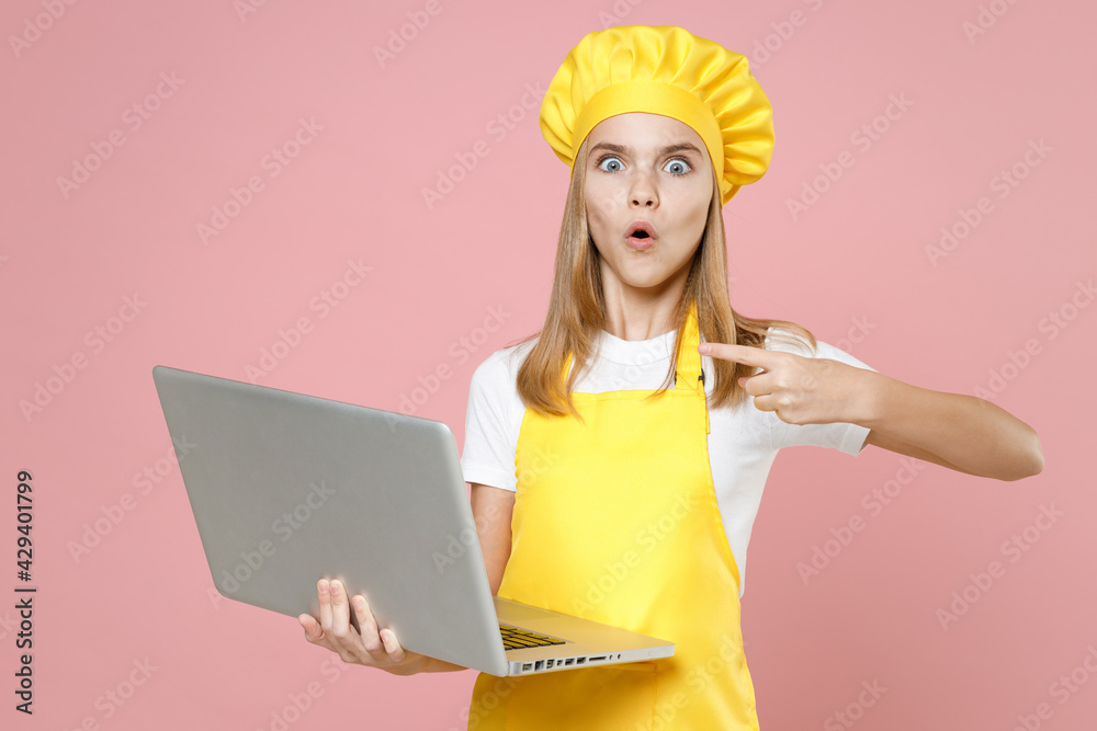 Teen shocked girl chef cook confectioner housewife baker wearing yellow ...