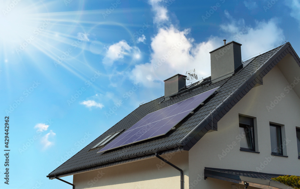 Photovoltaic panels on the roof. Solar panels on the gable roof of a ...