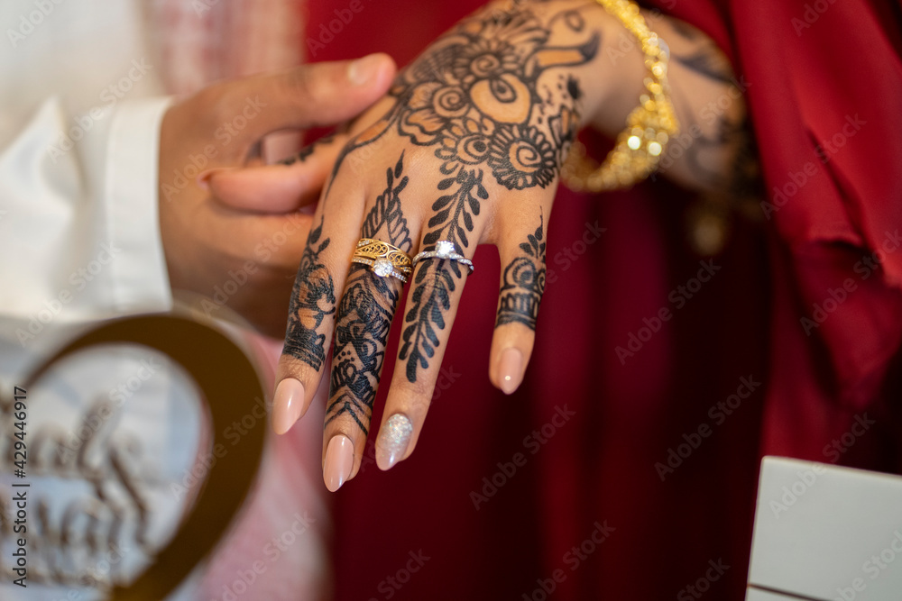 Black Muslim bride showing henna and ring Stock Photo | Adobe Stock