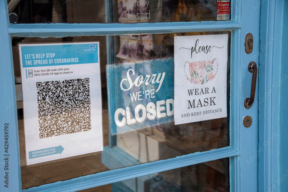 England, UK. 2021. Shop door with closed sign and Test and Trace Covid ...