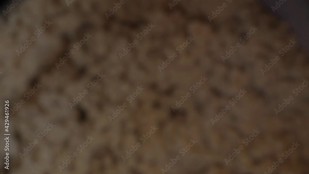 Close up shooting of a male hand crumbling a piece of hemp wool on the ...