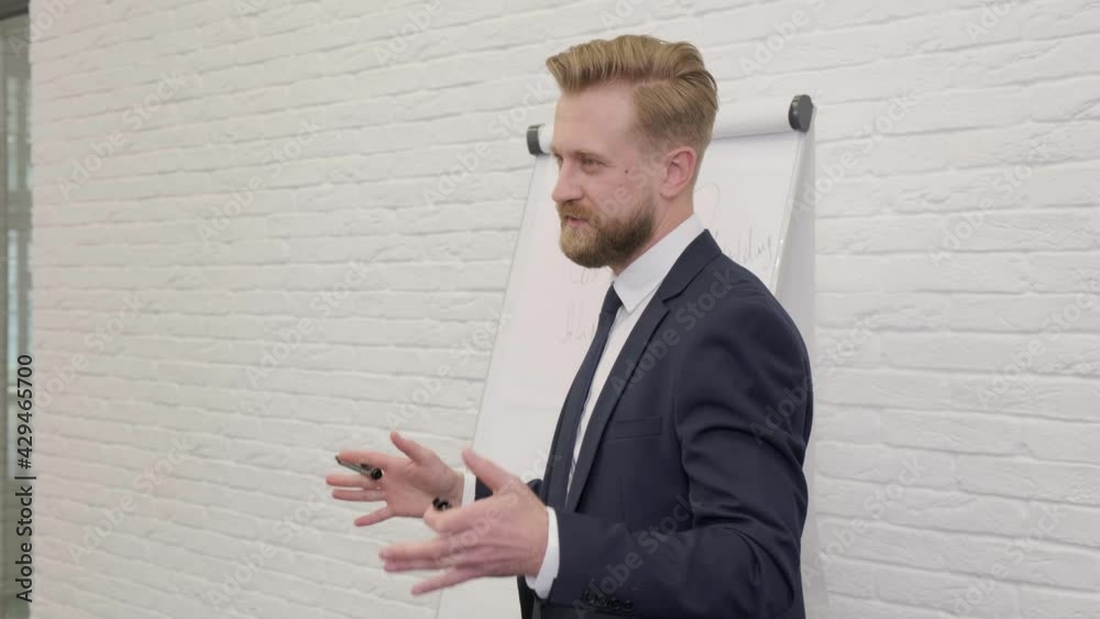 Business man coach speaker in suit give flipchart presentation, speaker ...