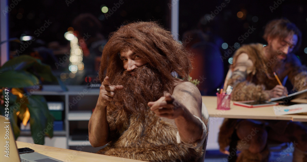 Portrait of Funny Bearded Caveman in Animal Fur Pointing to Camera ...