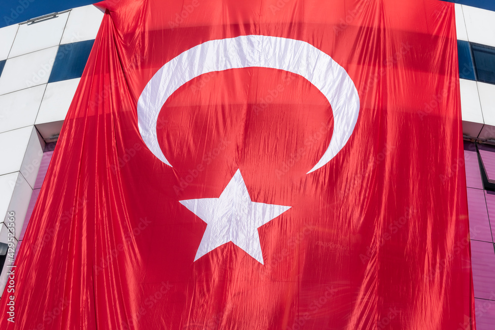 Giant Turkish red flag hanging upside down buildings on the National ...