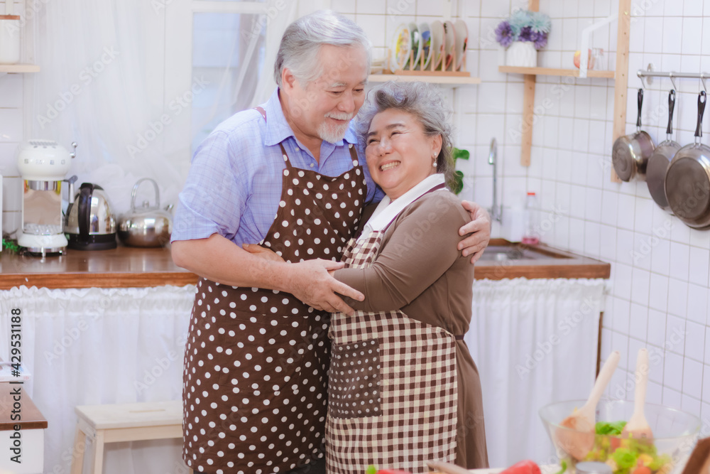 Asian Happy Retired Senior Smiling Cute Eldery Couple Hugging And Holding