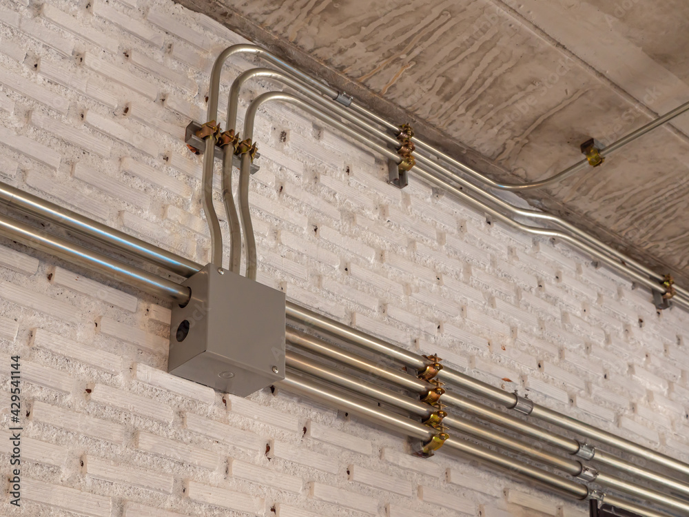 the installation of a electric wire system in the building on white ...