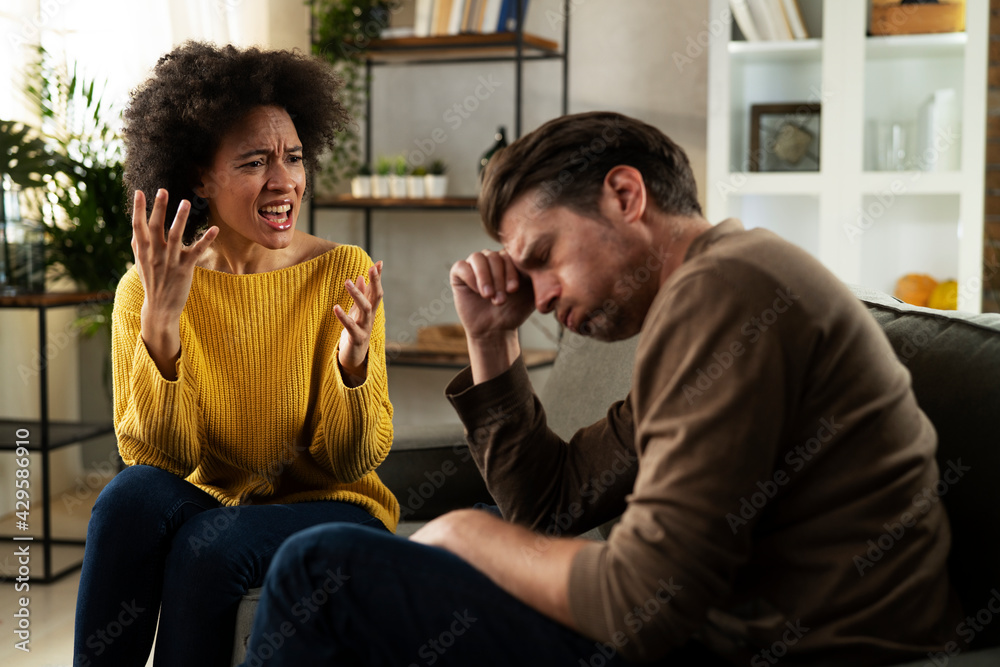 Frustrated young couple arguing at home. Stressed unhappy wife and ...