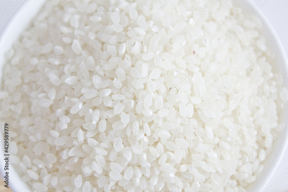 rice grains in a bowl isolated on white background. Stock Photo | Adobe ...