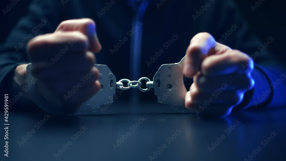 Video „Arrested criminal man in handcuffs in the interrogation room ...
