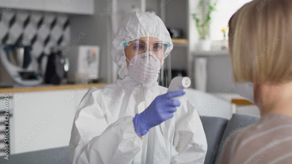 Fever of the patient under observation at home is measured. Shot with ...