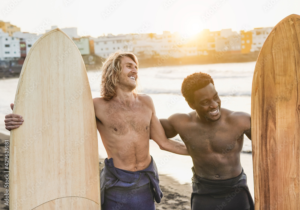 Multiracial surfer men having fun on the beach - Happy young people ...