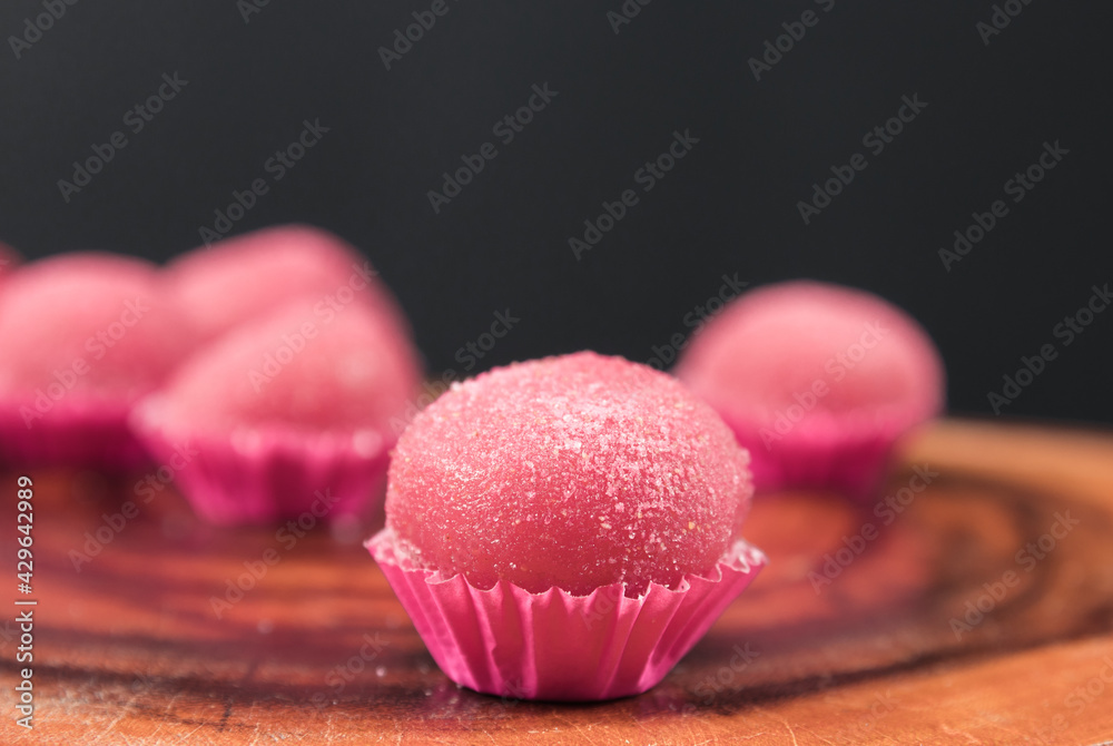 Strawberry brigadeiro. Traditional Brazilian sweet called Bicho de Pé ...