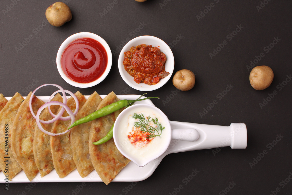 Traditional Indian food Aloo paratha or potato stuffed flat bread ...
