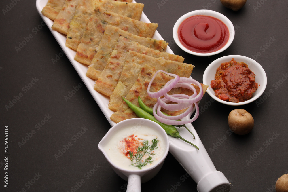 Traditional Indian food Aloo paratha or potato stuffed flat bread ...