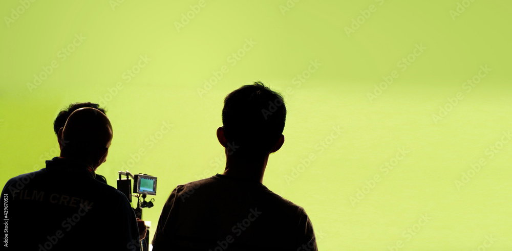 Film production behind the scene. Video production in studio with green ...