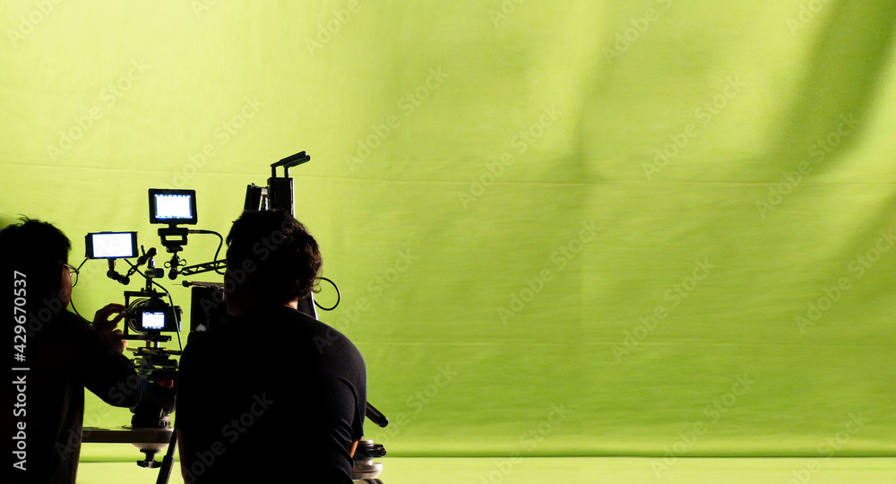 Film production behind the scene. Video production in studio with green ...