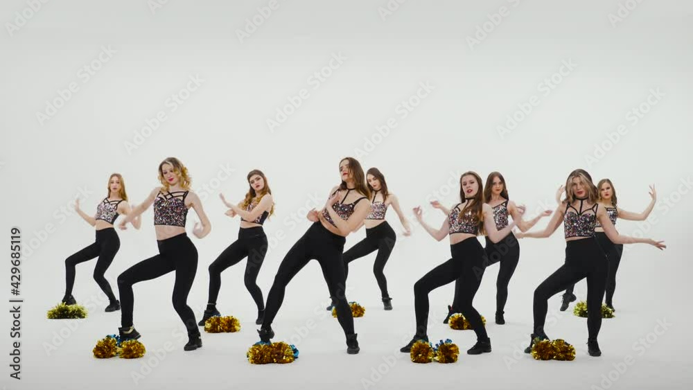 Vidéo Stock Group of athletic cheerleaders in silver tops and black ...