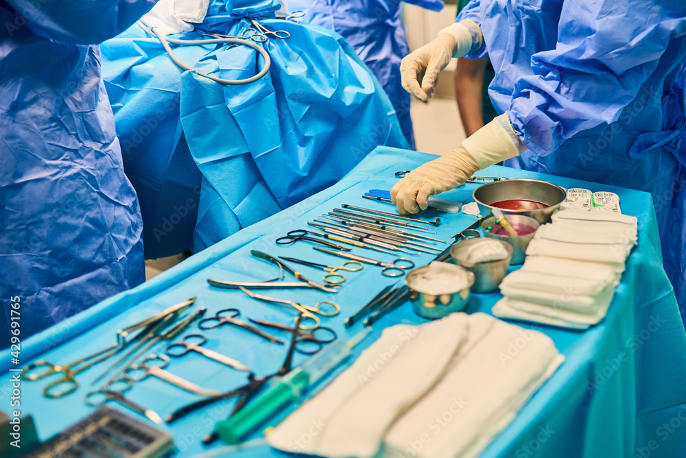 sterile operating table in the operating room with a variety of ...