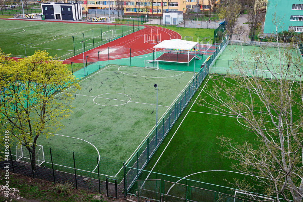 Open city sports grounds for playing football. Stadium, empty astro ...