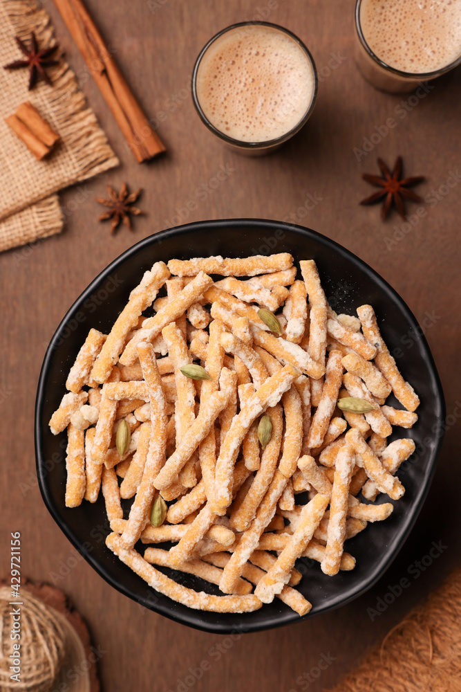 Madhura Seva Kerala fried snacks sweet food and Indian milk tea masala ...