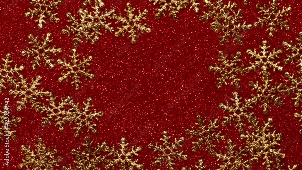 Christmas ornament frame with golden snow flakes on red glitter ...