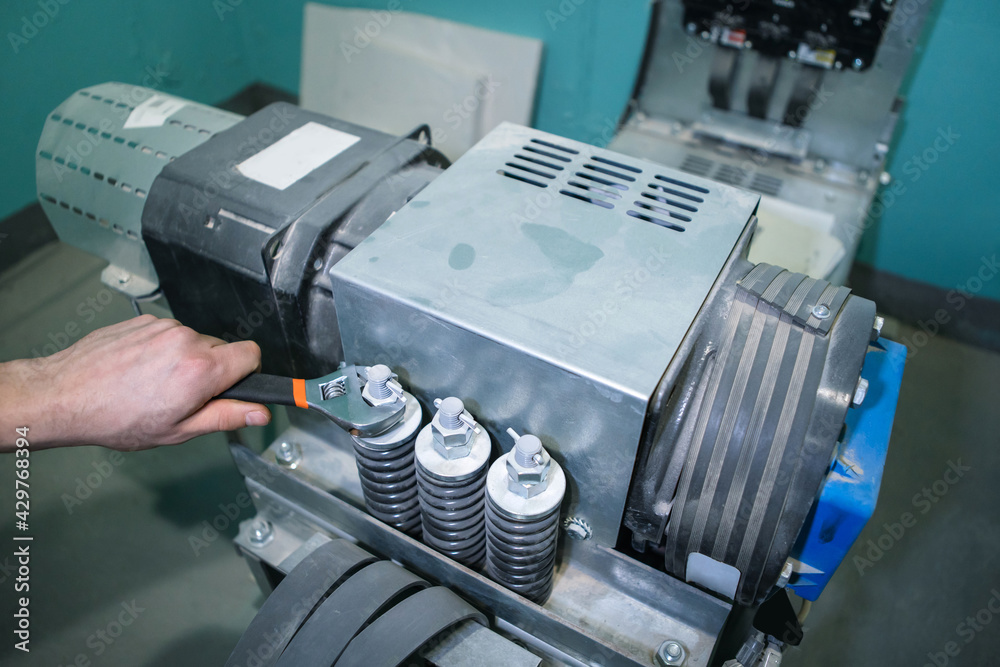 Repair of elevator equipment. Adjusting the damping springs in the ...