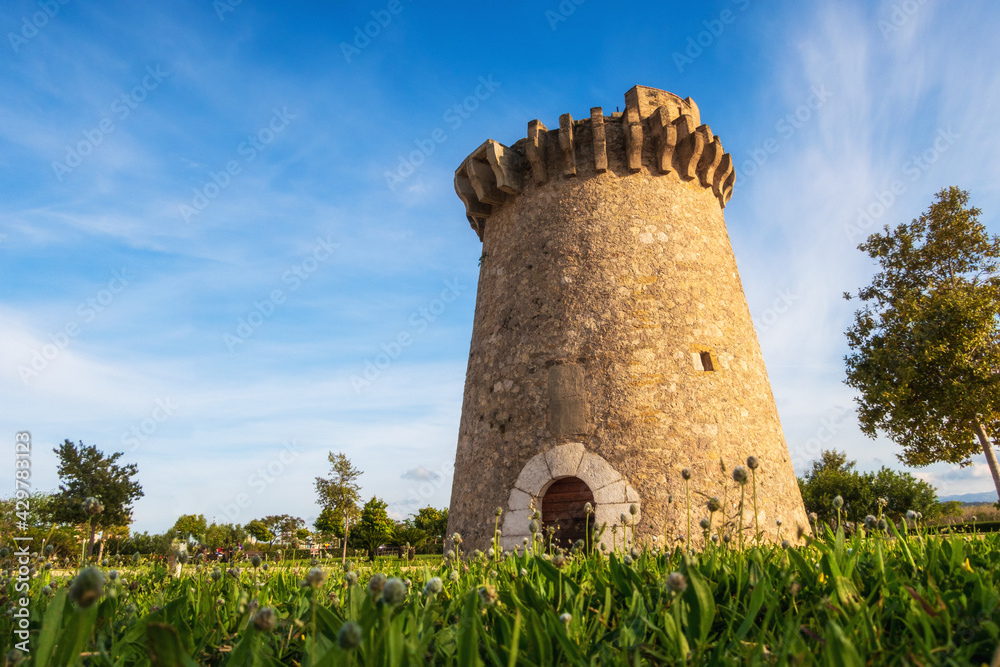 The famous Torre de Piles, on Piles beach, an old watchtower, now ...