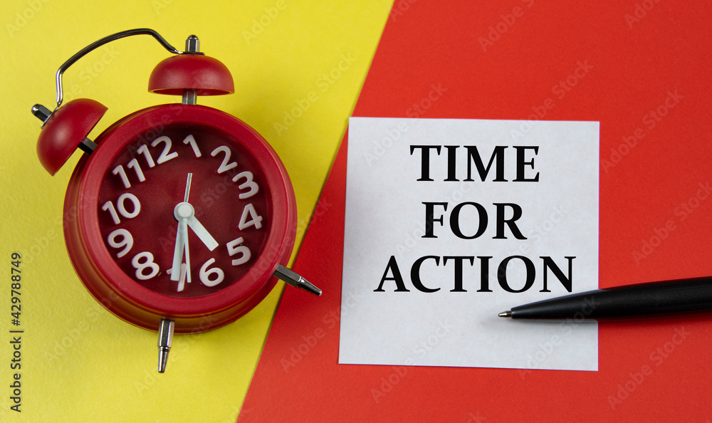 TIME FOR ACTION - words on a white sheet on a multi-colored background ...