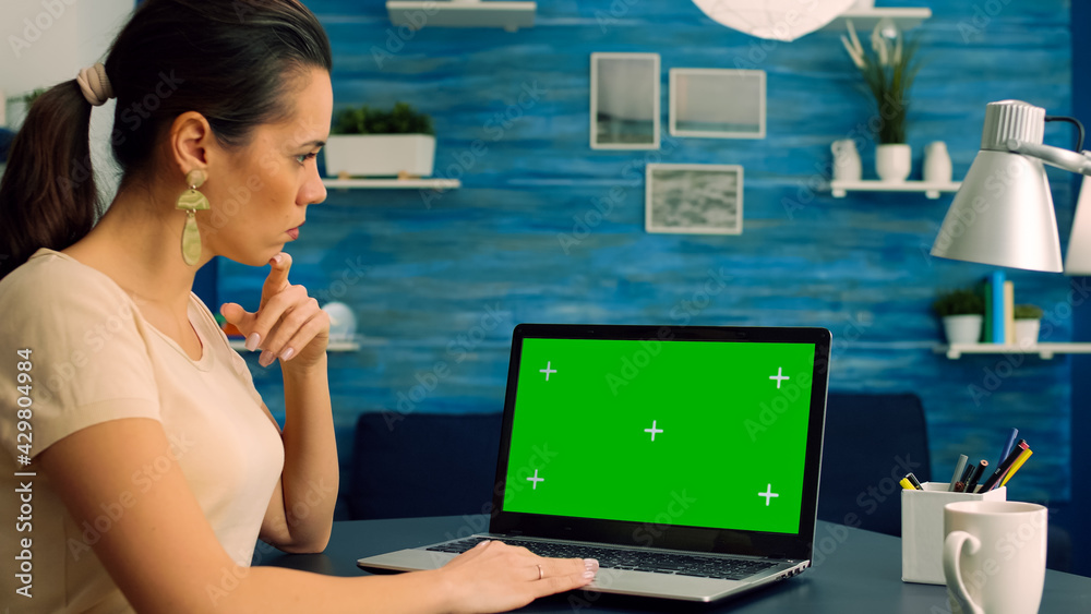 Caucasian female working at business comunication project on laptop ...