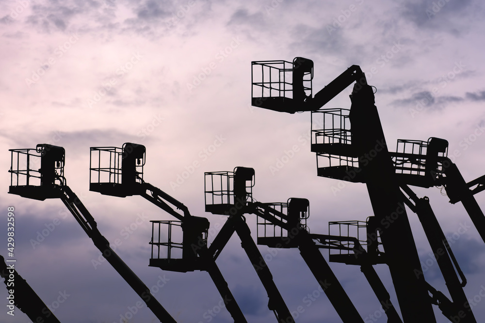 Silhouettes of aerial work platforms (AWP), also known as aerial ...
