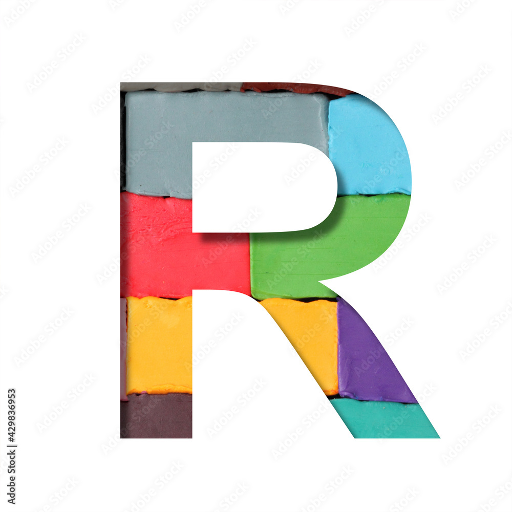 Multi-colored plasticine font. Letter R cut out of paper on a ...