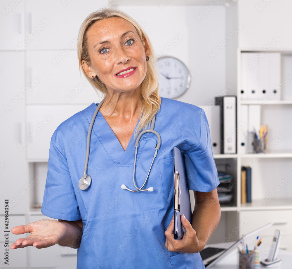 Female doctor making welcome gesture, politely inviting patient in ...