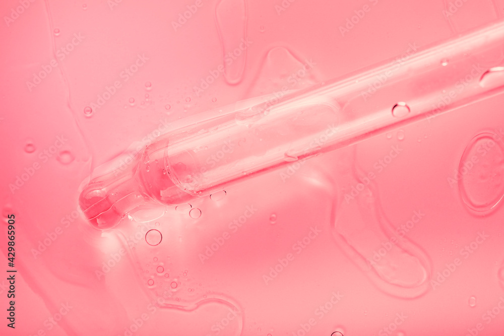 Liquid pipette pink gel or serum glass of microscope background Stock ...