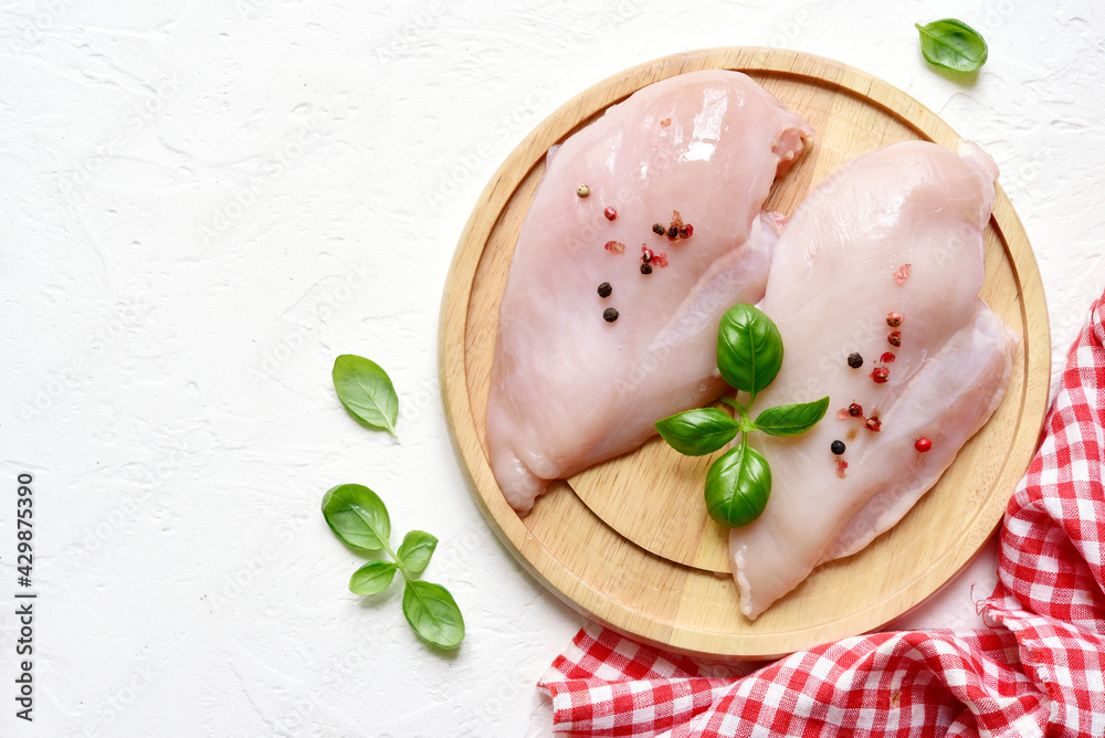 Raw chicken fillet with ingredients for making. Top view with copy ...